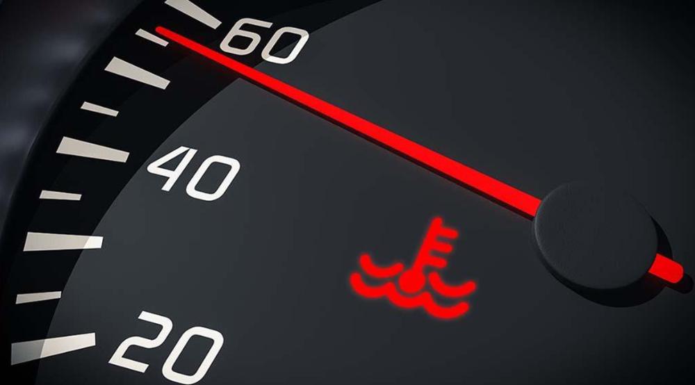 What causes the engine temperature warning light?