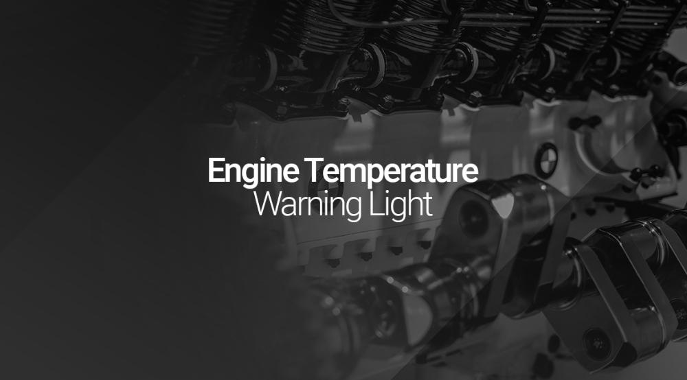 What causes the engine temperature warning light?